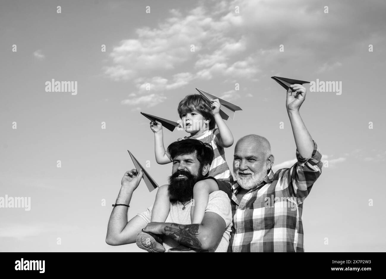 Three different generations ages: grandfather father and child son ...