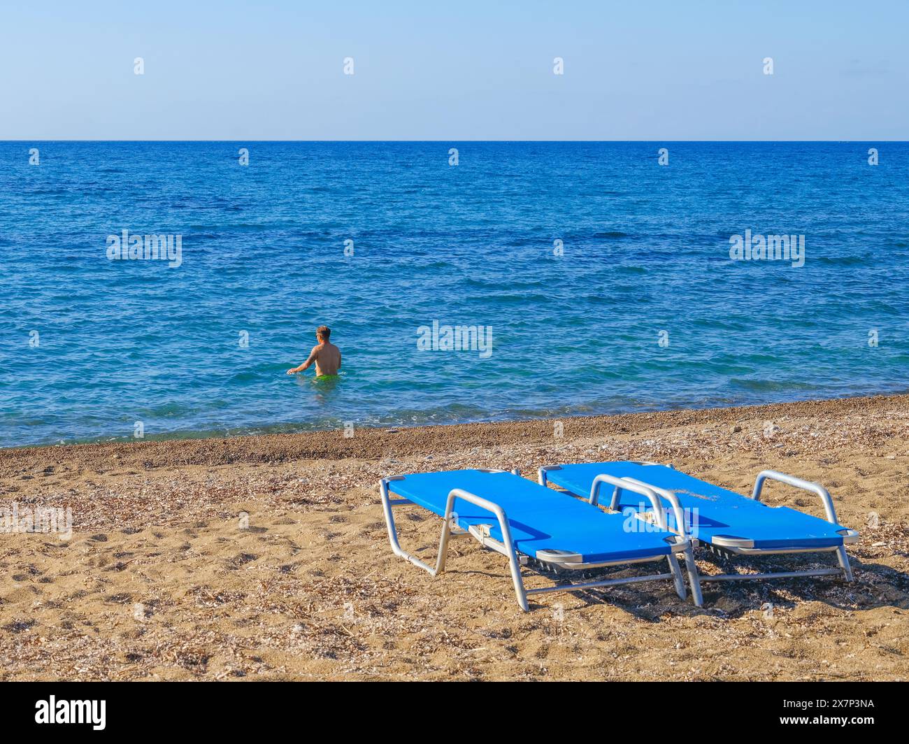 May 2024, Empty sun beds on the beach at Latsi, Cyprus Stock Photo - Alamy