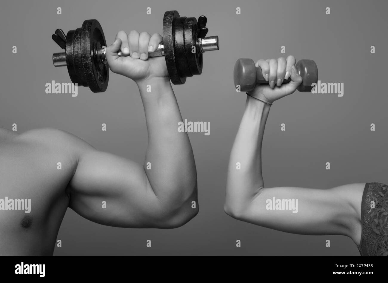 Male and female hands with dumbbells close-up. Training muscles. Female ...