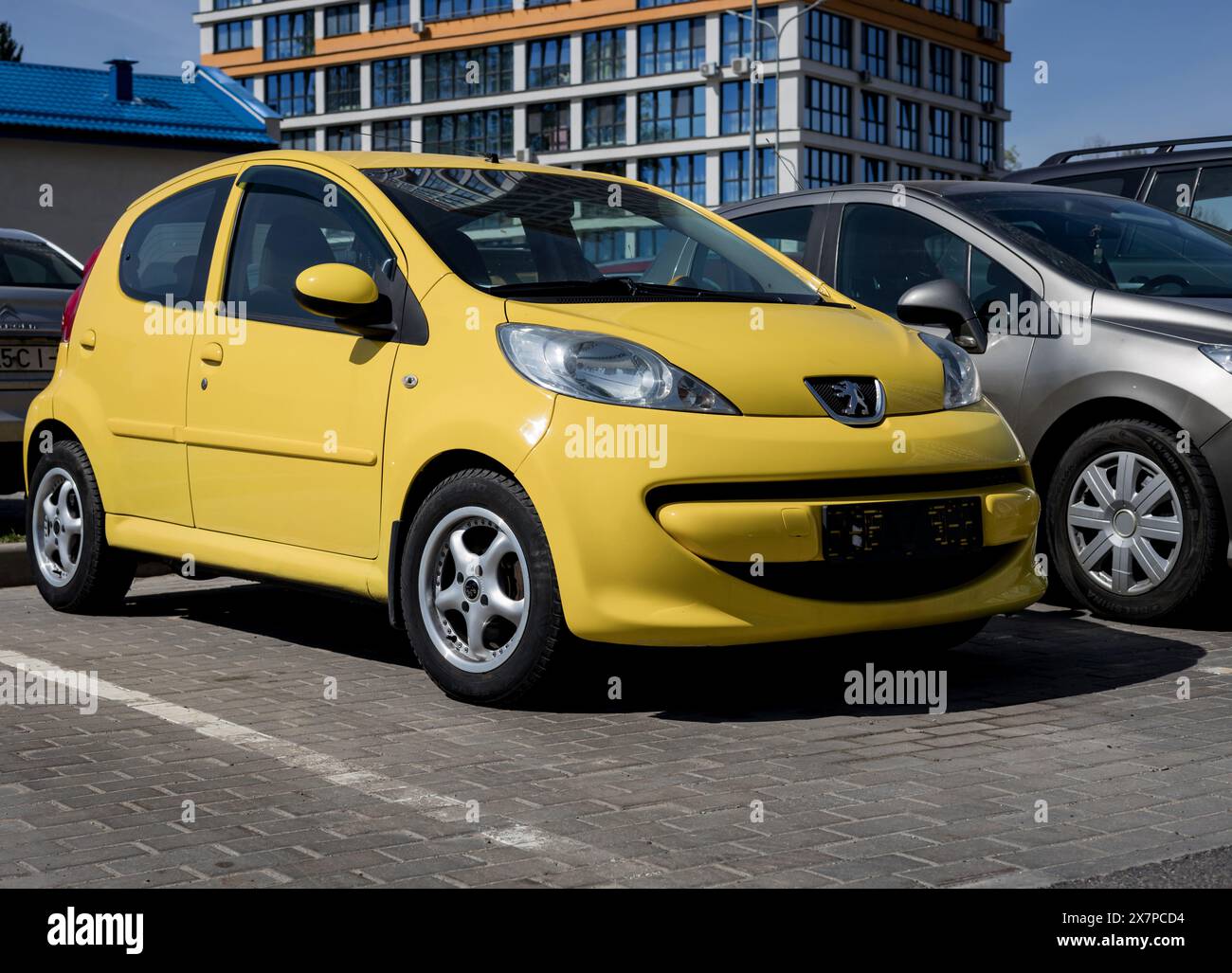 Minsk, Belarus, may 21, 2024 - Front view yellow Peugeot 107 on parking ...