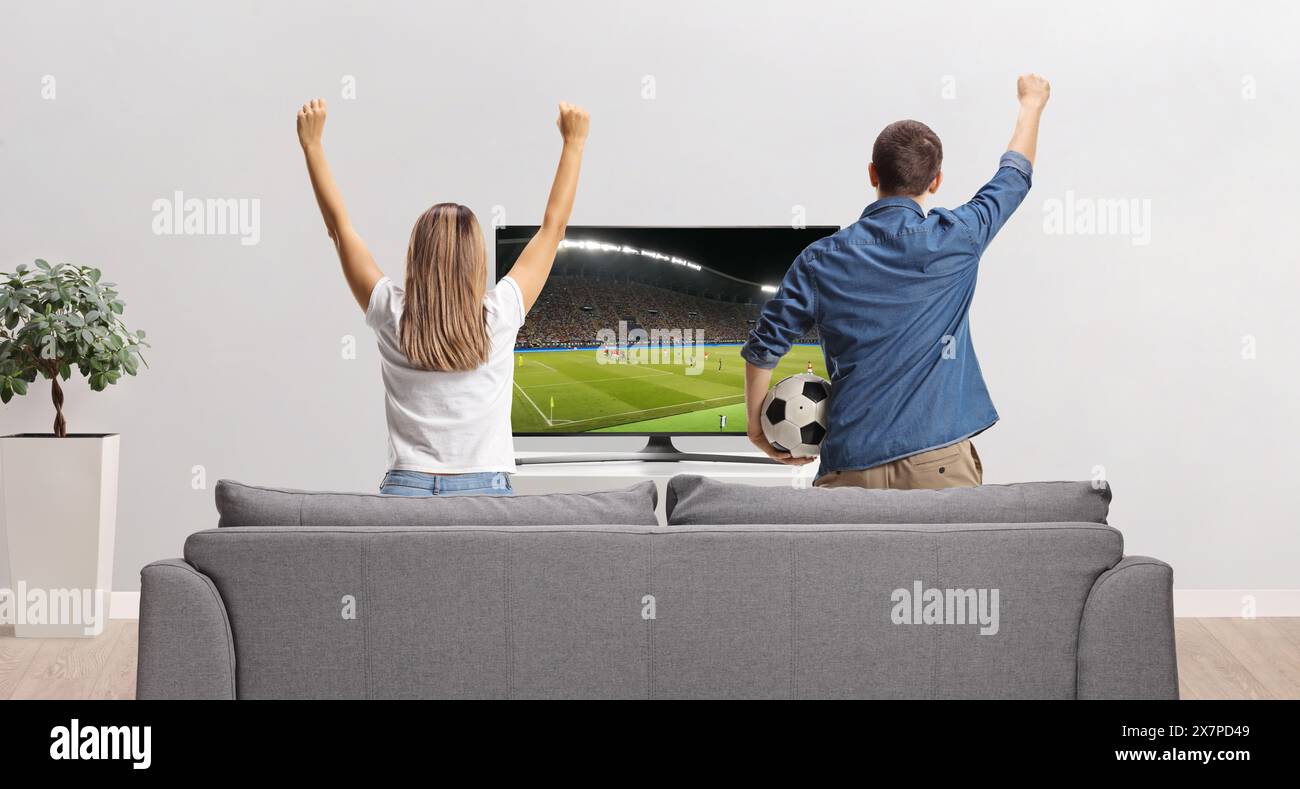 Young couple watching soccer on hi-res stock photography and images - Alamy