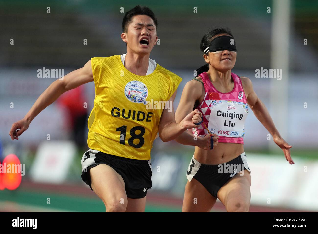 Kobe, Japan. 21st May, 2024. Liu Cuiqing (R) of China and her guide Chen Shengming compete ...