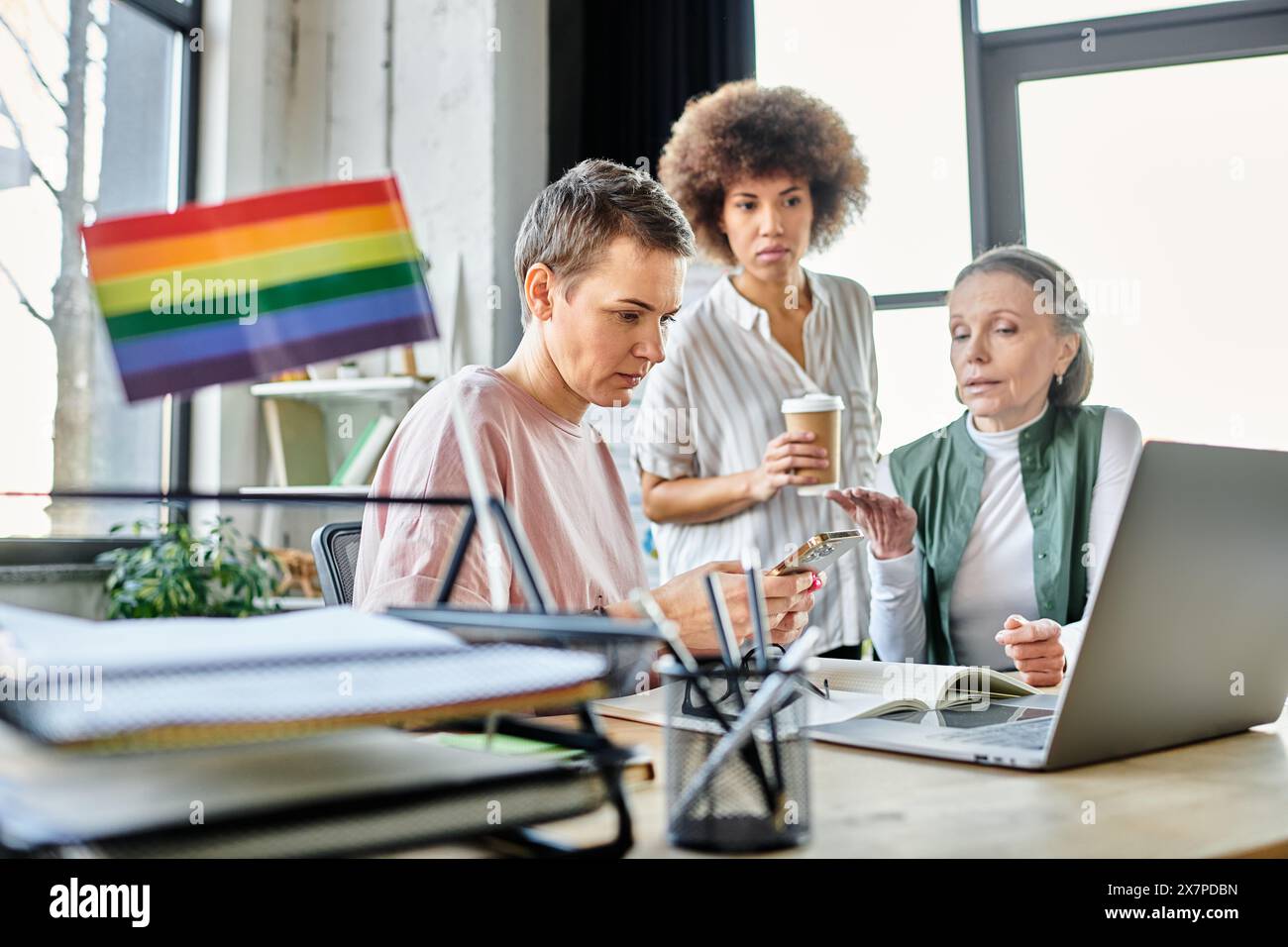 Attentive diverse businesswomen, including members of the LGBT ...
