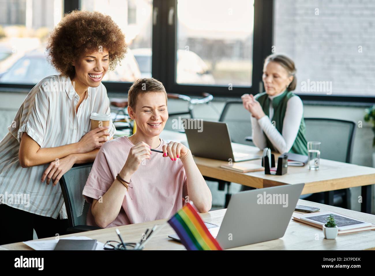 Joyous diverse businesswomen working together on project in office ...