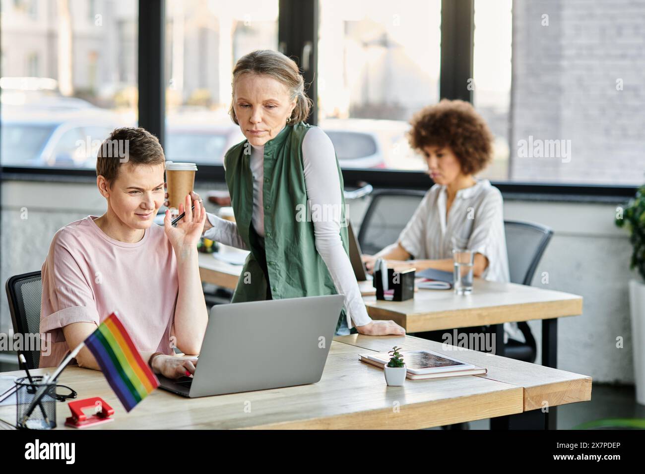 Attentive diverse businesswomen working together on project in office ...