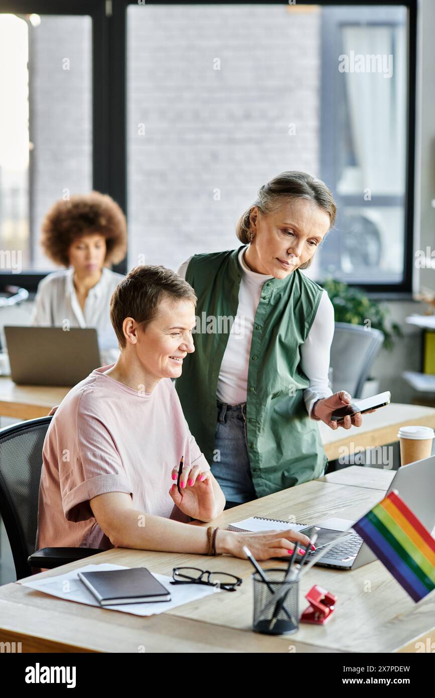 Jolly diverse businesswomen working together on project in office ...