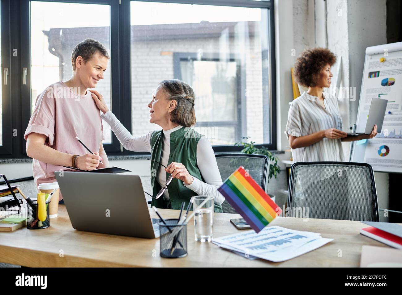 Elegant diverse female professionals working together on their project ...
