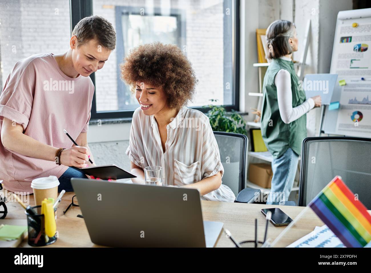 Beautiful diverse female professionals working together on their ...