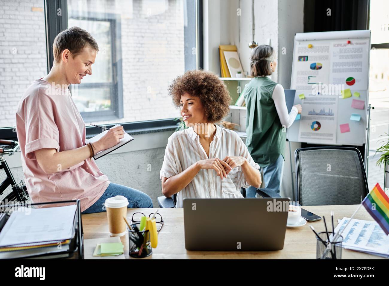 Joyous diverse female professionals working together on their project ...
