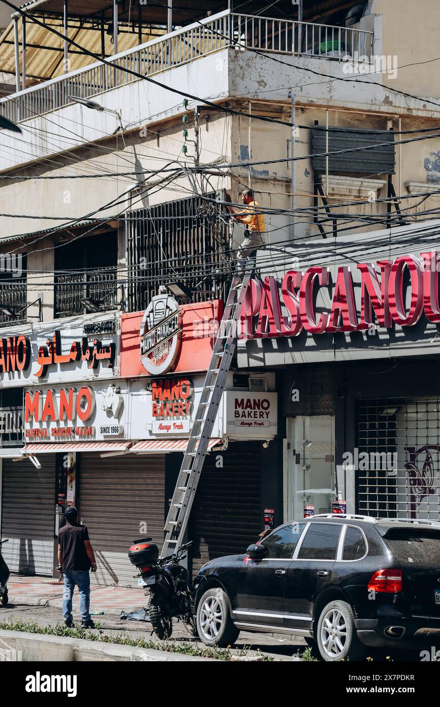 Beirut, Lebanon — 24.04.2023: Workers install electric wires in the ...