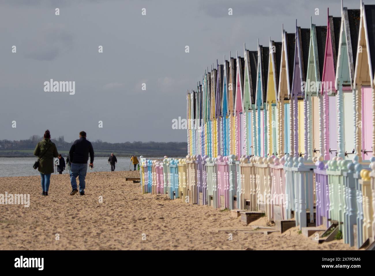 Pretty coloured beach huts on West Mersea beach in Essex UK Stock Photo ...