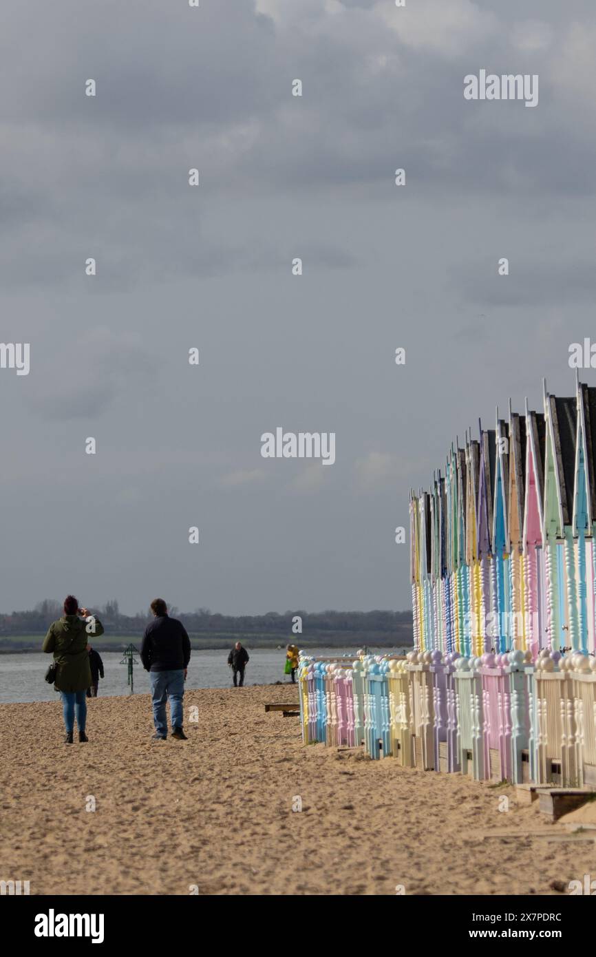 Pretty coloured beach huts on West Mersea beach in Essex UK Stock Photo ...