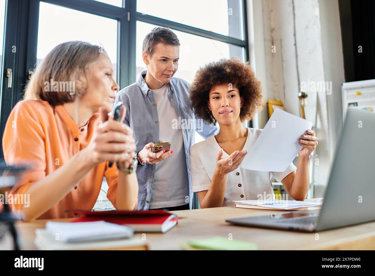 People standing around computer in hi-res stock photography and images ...