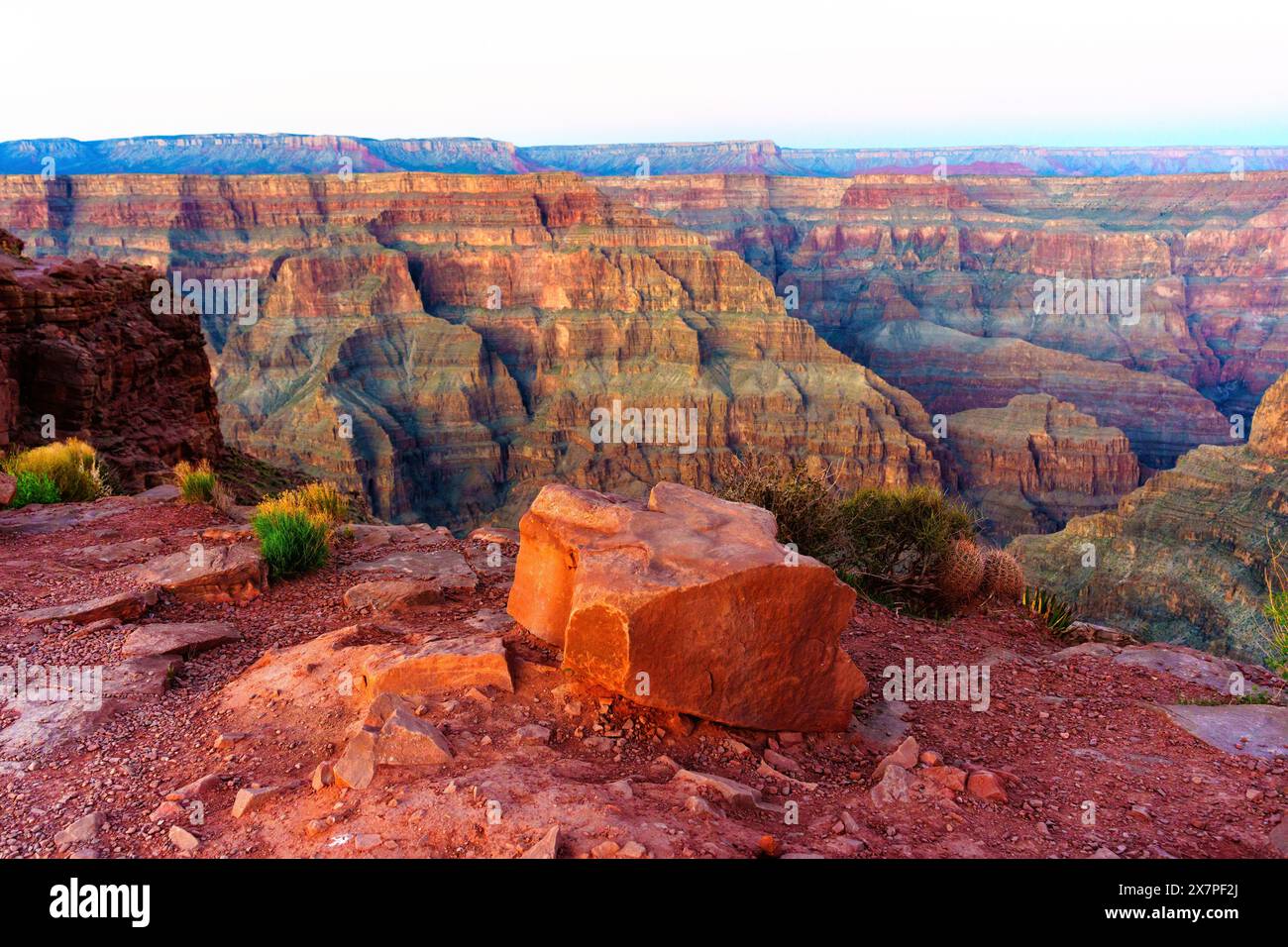 Panoramic view of the Grand Canyon in warm hues of the setting sun ...