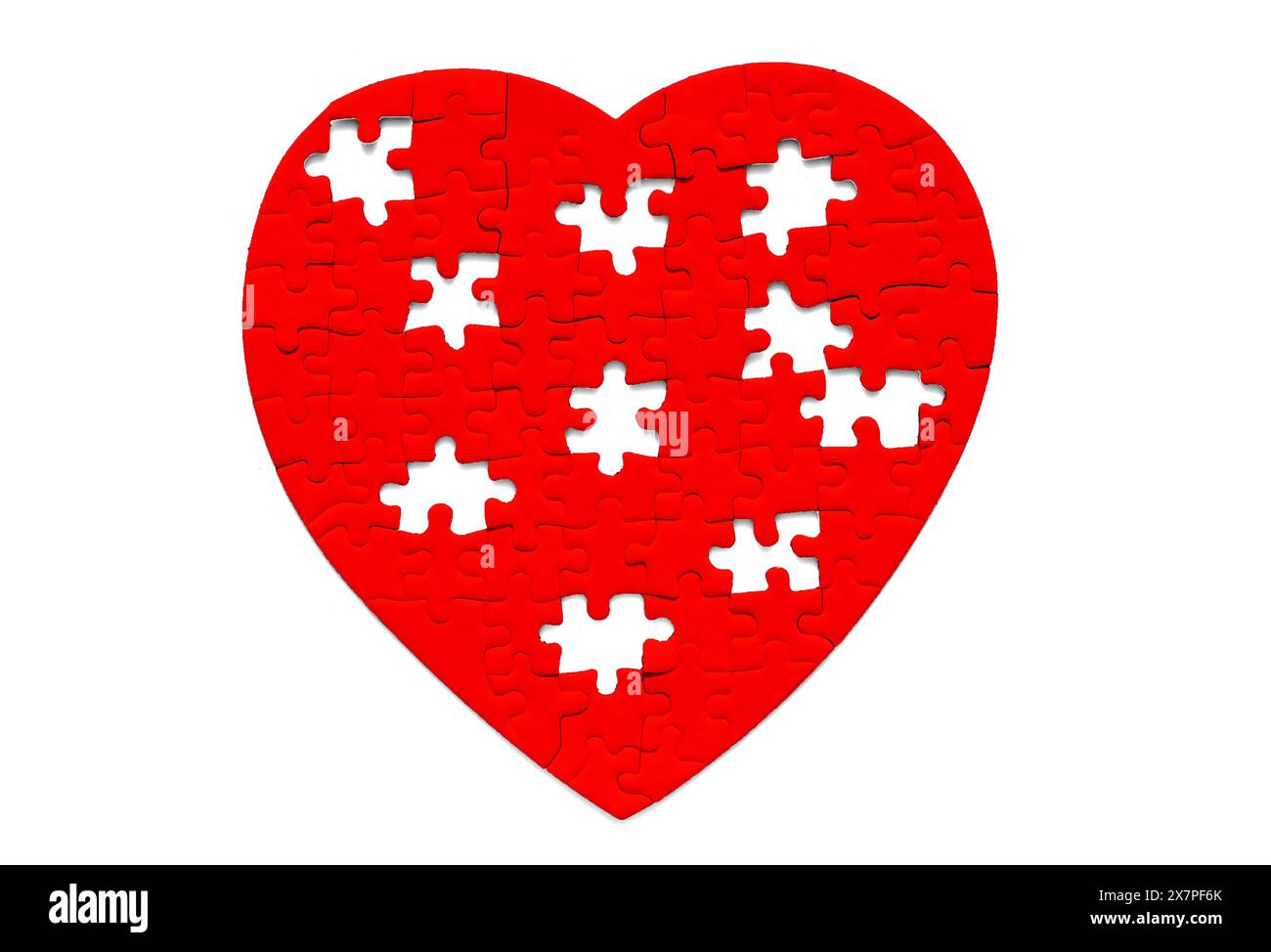 Red heart-shaped puzzle with missing pieces set on a white backdrop ...