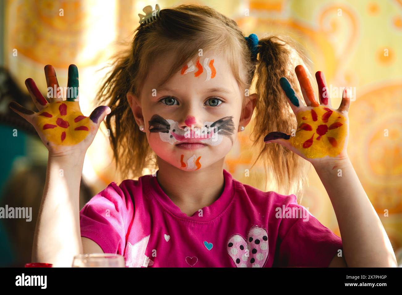 A girl with a colorful painted face, capturing the essence of childhood ...