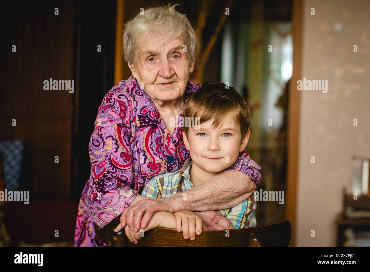 A grandma and her grandson enjoying each other's company in the comfort ...