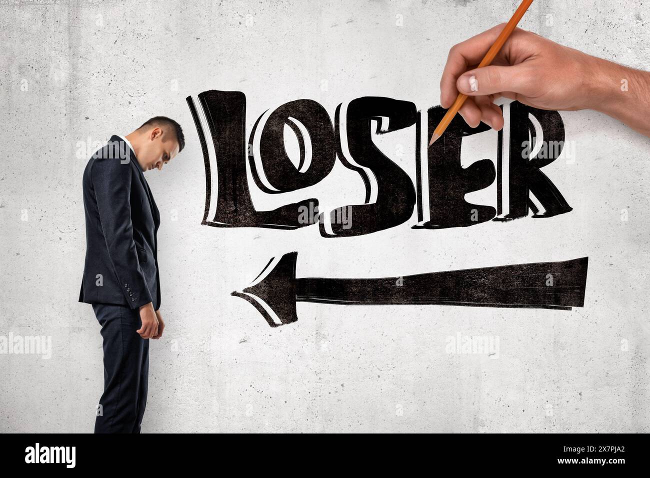 Man facing 'LOSER' label with pencil arrow Stock Photo - Alamy