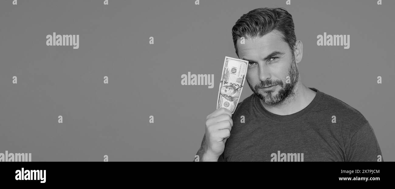 Man with money cash. 100 dollars banknotes. Portrait of man holding ...