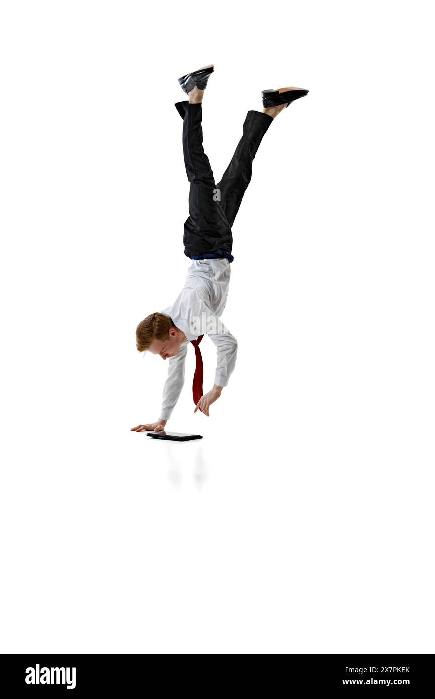 Dynamic Stability. Business professional skillfully balances on one ...