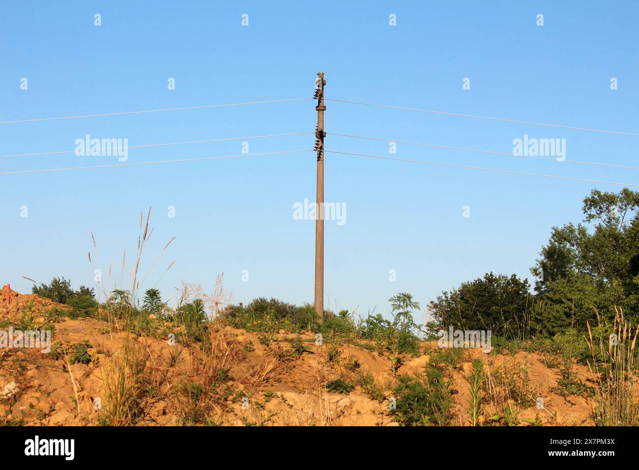 Concrete electrical power line utility pole with multiple ceramic ...