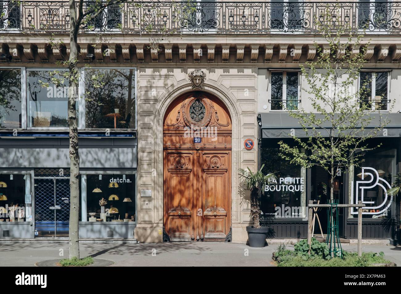 Paris, France - 16 April 2023: Beautiful door in an old haussmann house ...