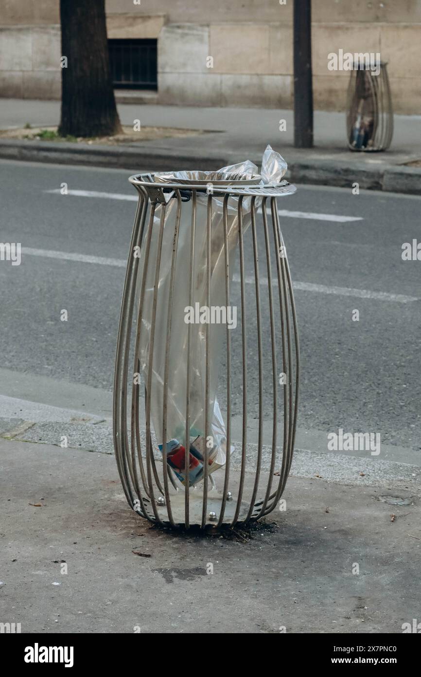 A typical Parisian trash can on a street in the 13th arrondissement ...