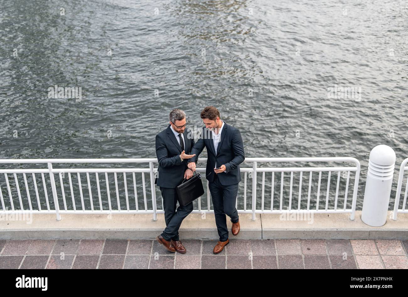 Outdoor business meeting. Business communication. Two business men ...