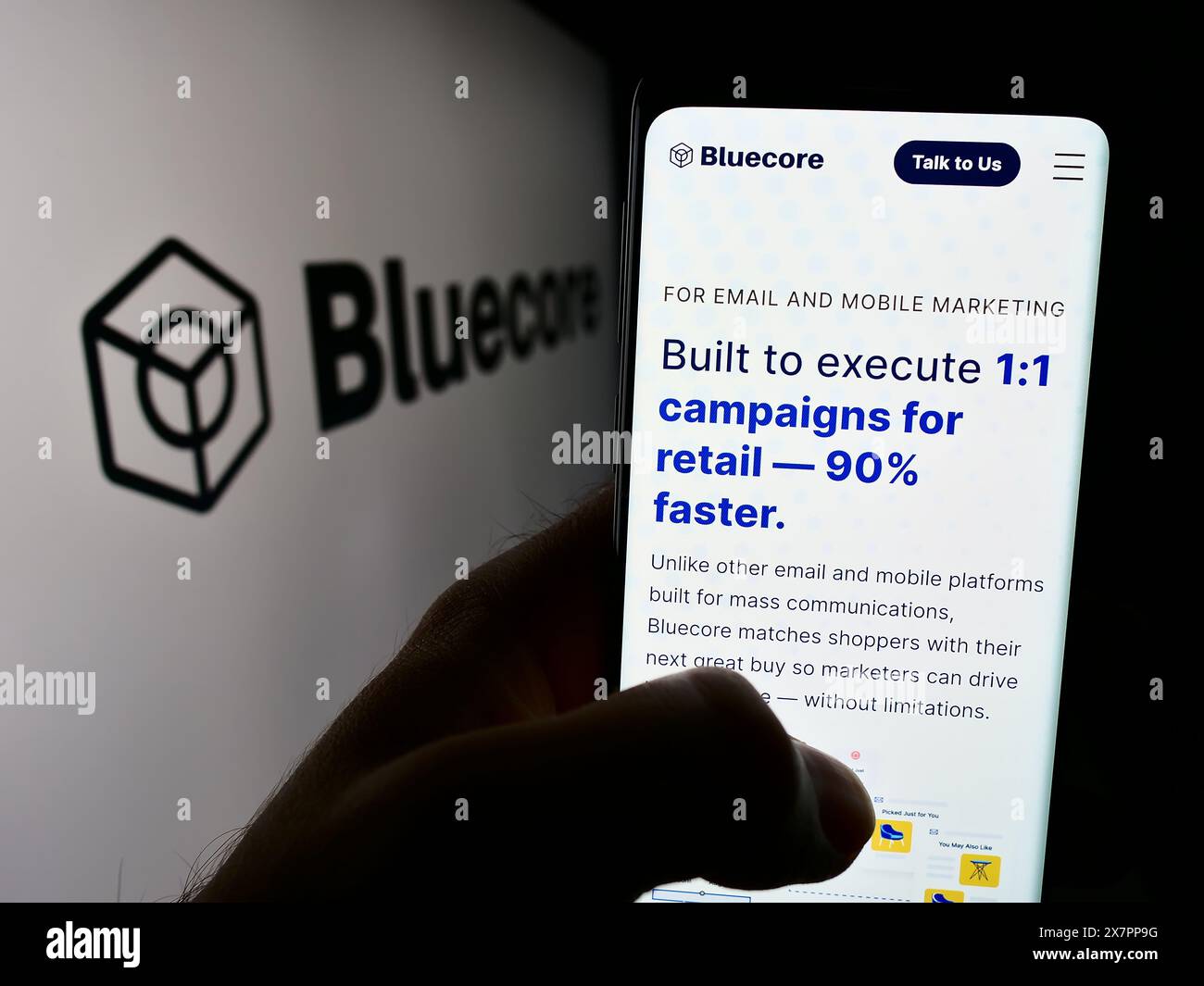 Person holding smartphone with website of US marketing technology ...
