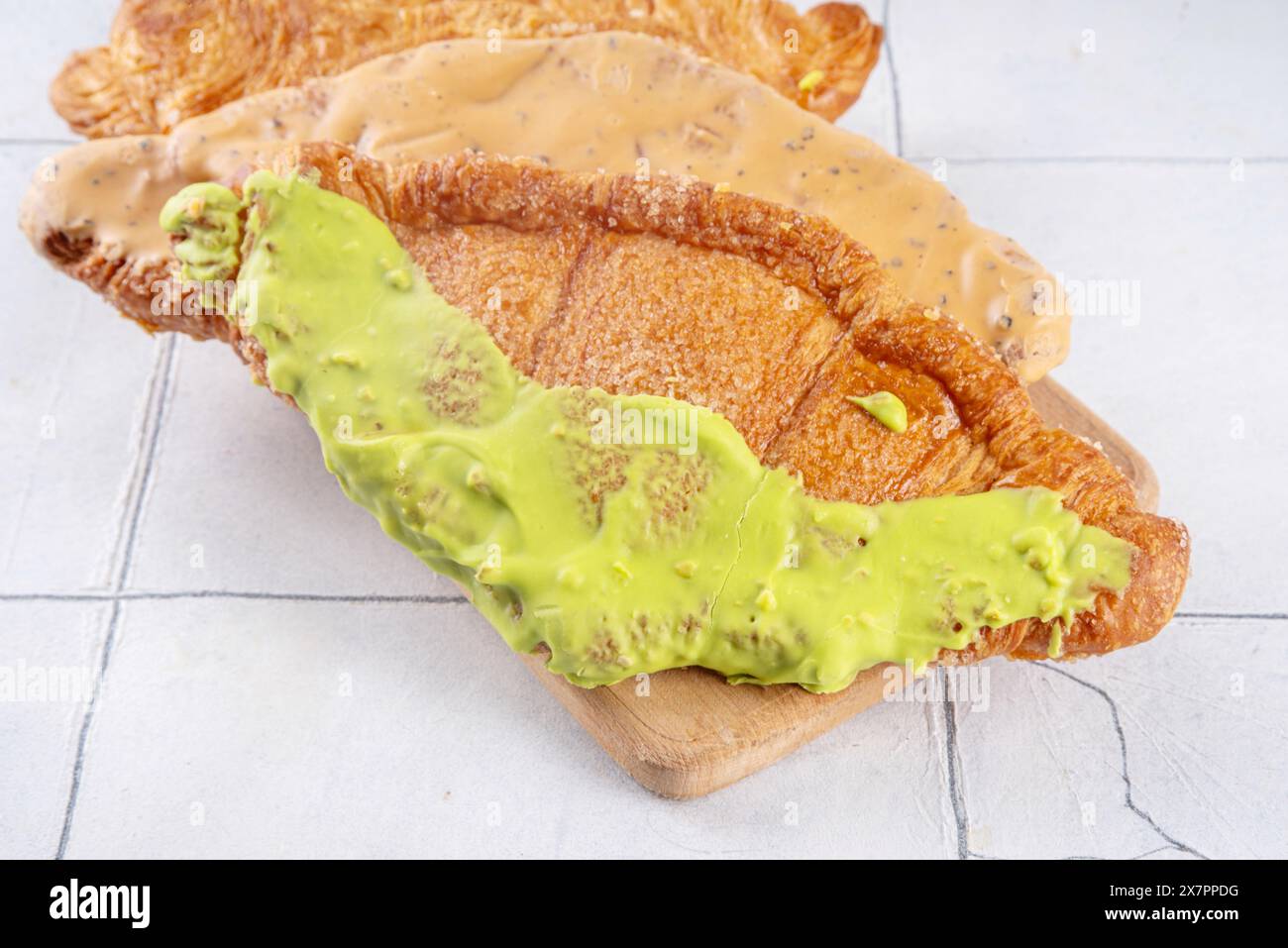 Set of colorful trendy flat croissants with different topping and ...