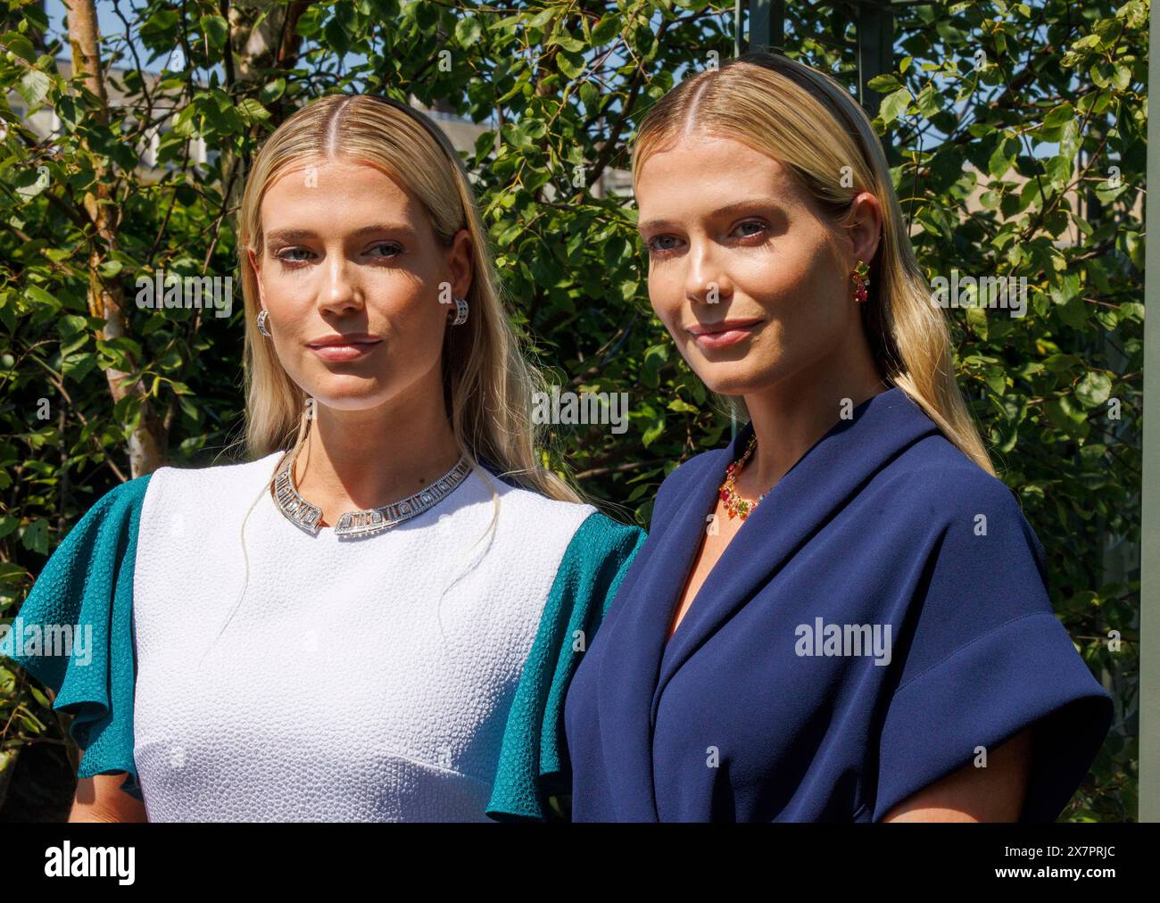 Lady Amelia Spencer (L) and her twin sister Lady Eliza Spencer (R) wear ...
