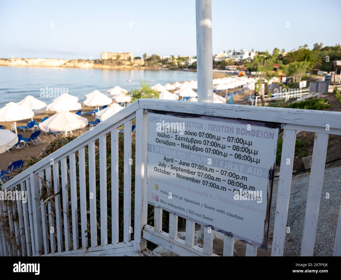 May 2024, Notice of Lifeguard hours posted on the beach near Pegeia ...
