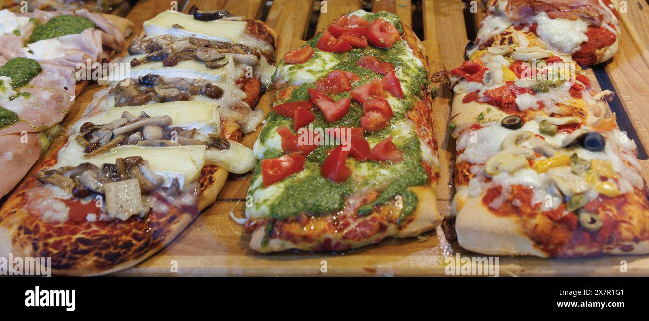 Venice, Venice Province, Veneto Region, Italy. Slices of pizza in a ...