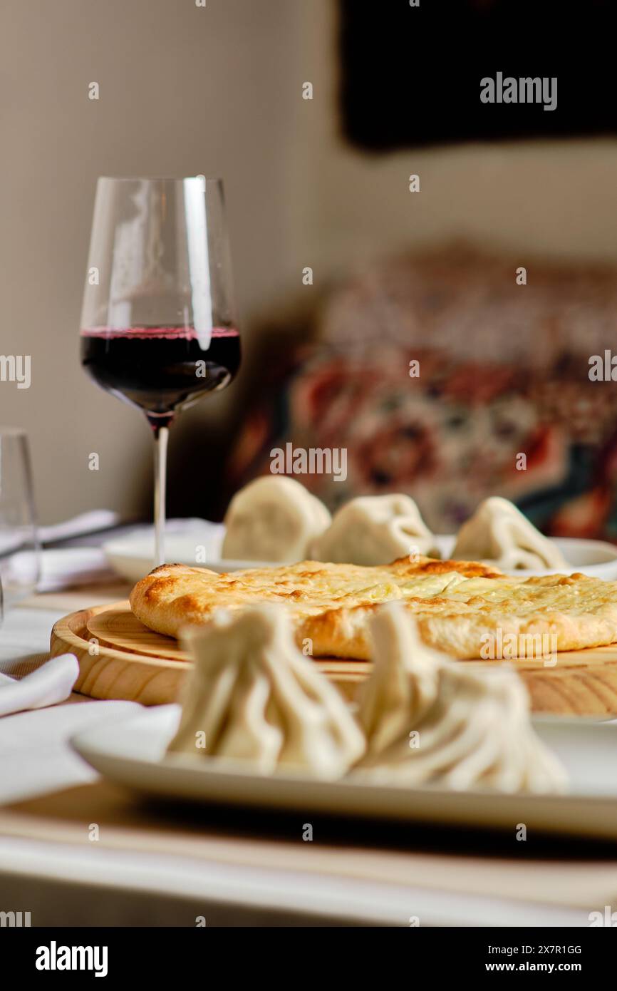 A traditional Georgian feast featuring khachapuri and khinkali ...