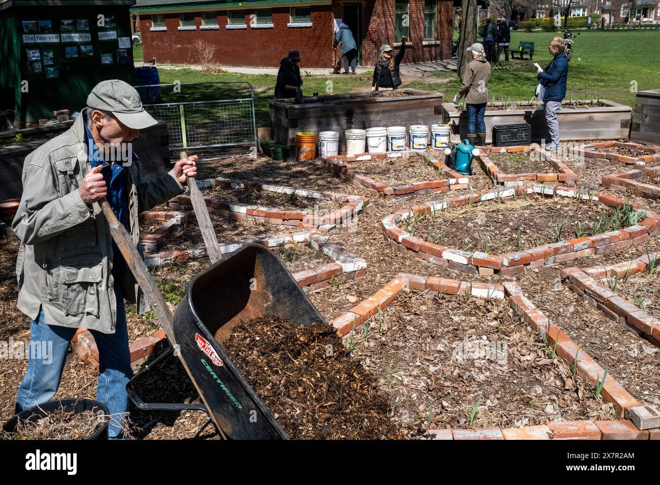 Preparing the soil before planting at the Dufferin Grove Park shared ...