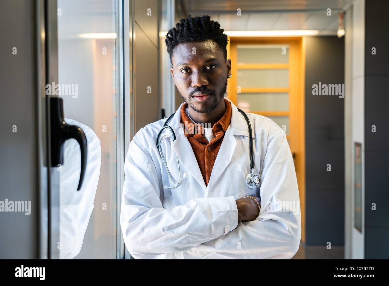 Confident male doctor stands hi-res stock photography and images - Alamy