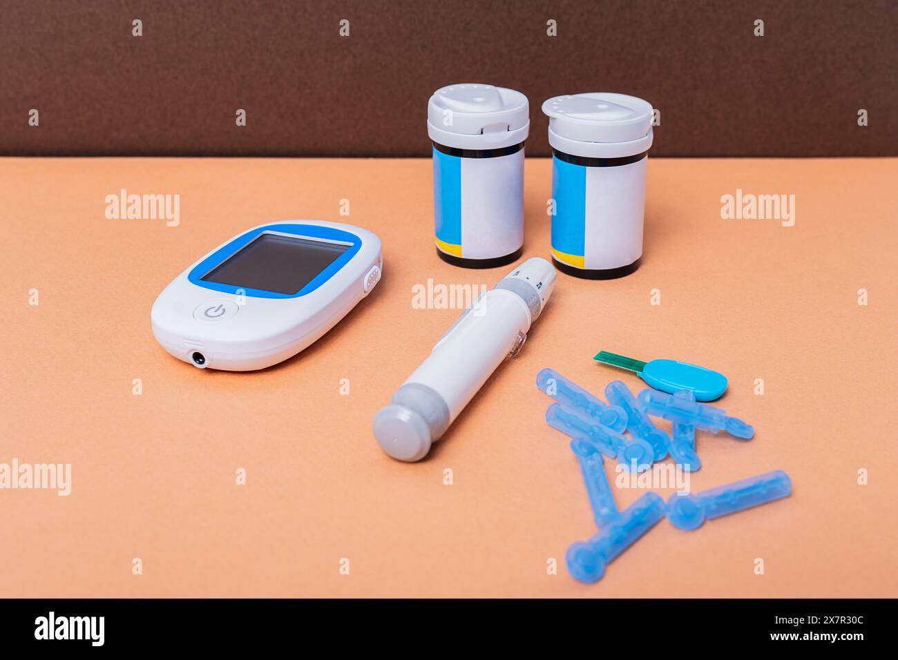 Diabetes management essentials featuring a glucose meter, insulin pen ...