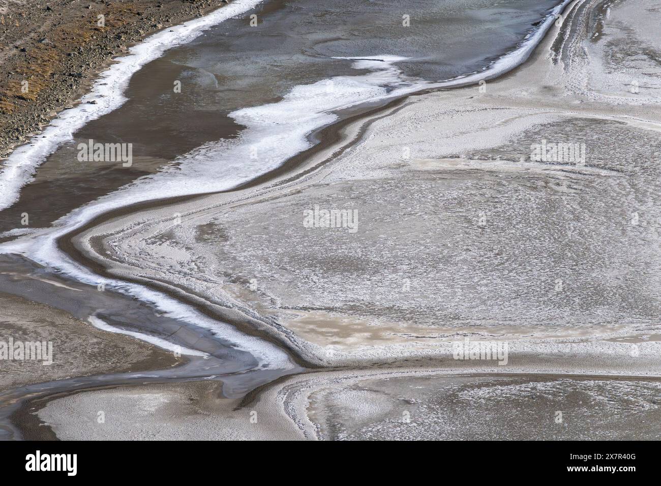 Aerial view of winding riverbeds with textured patterns in the ...