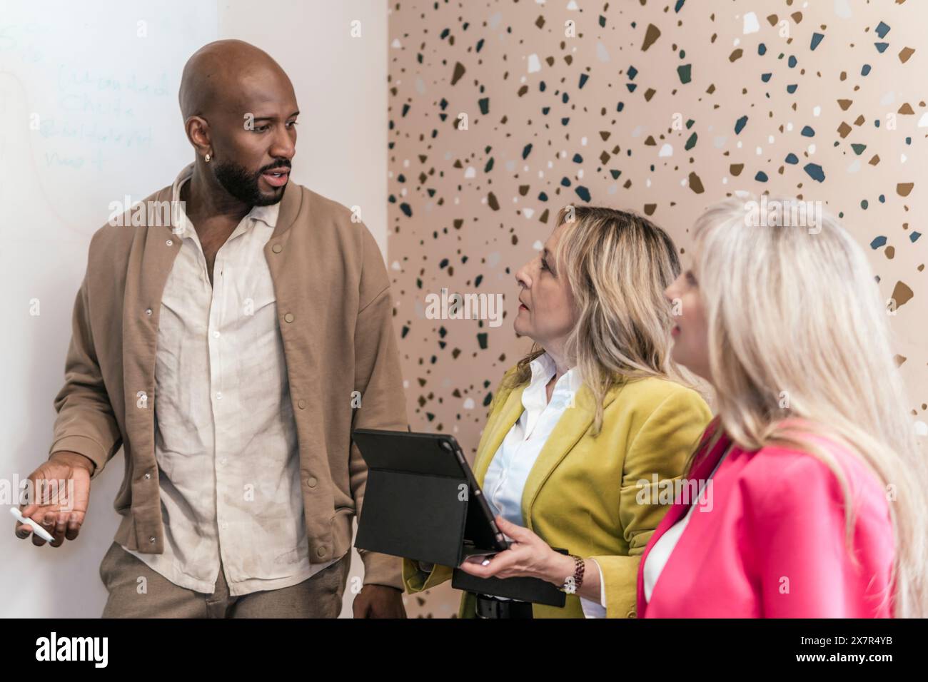 A diverse group of professionals engage in a collaborative discussion ...