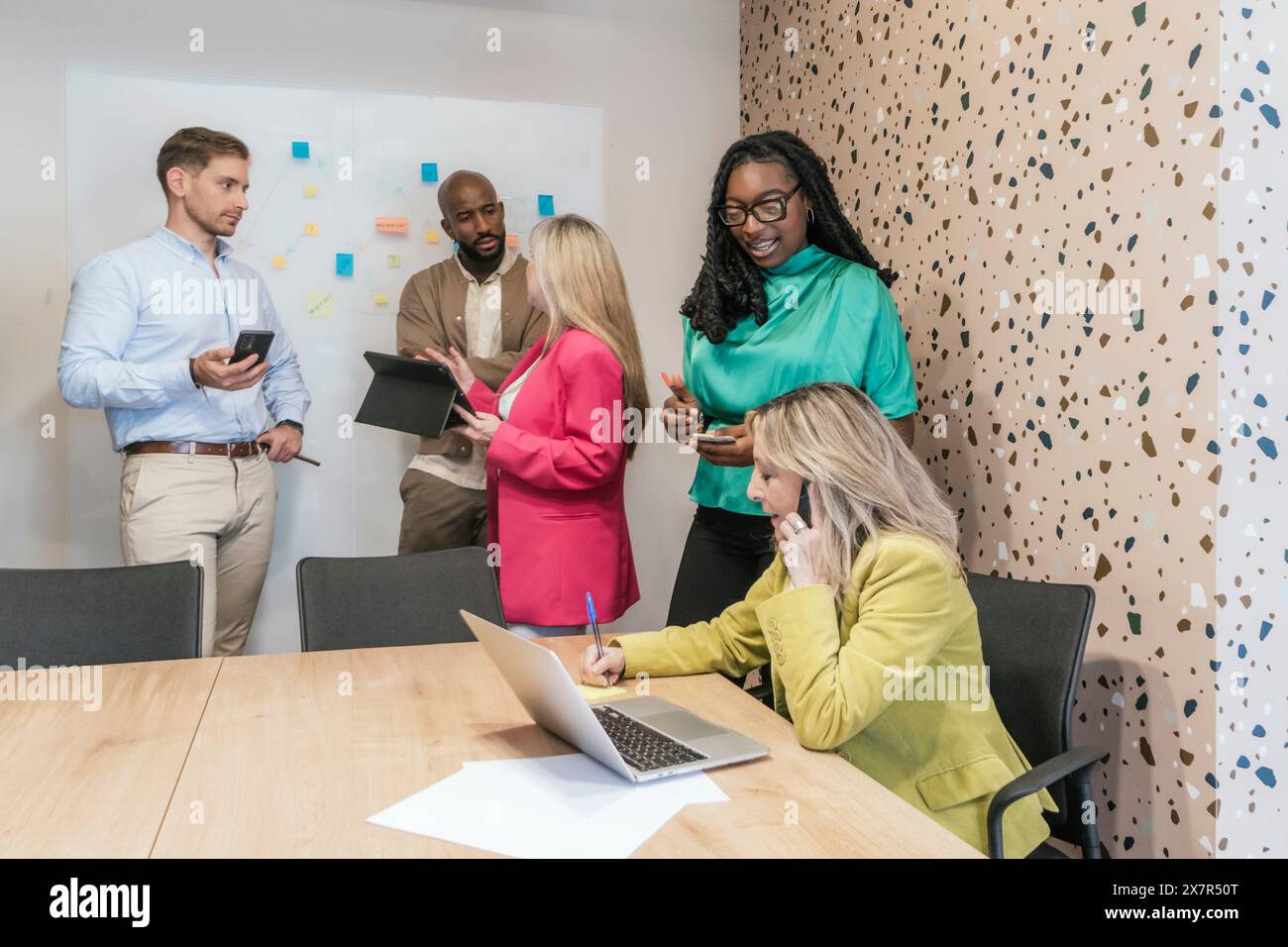 A multiethnic group of professionals collaborating and engaging in ...