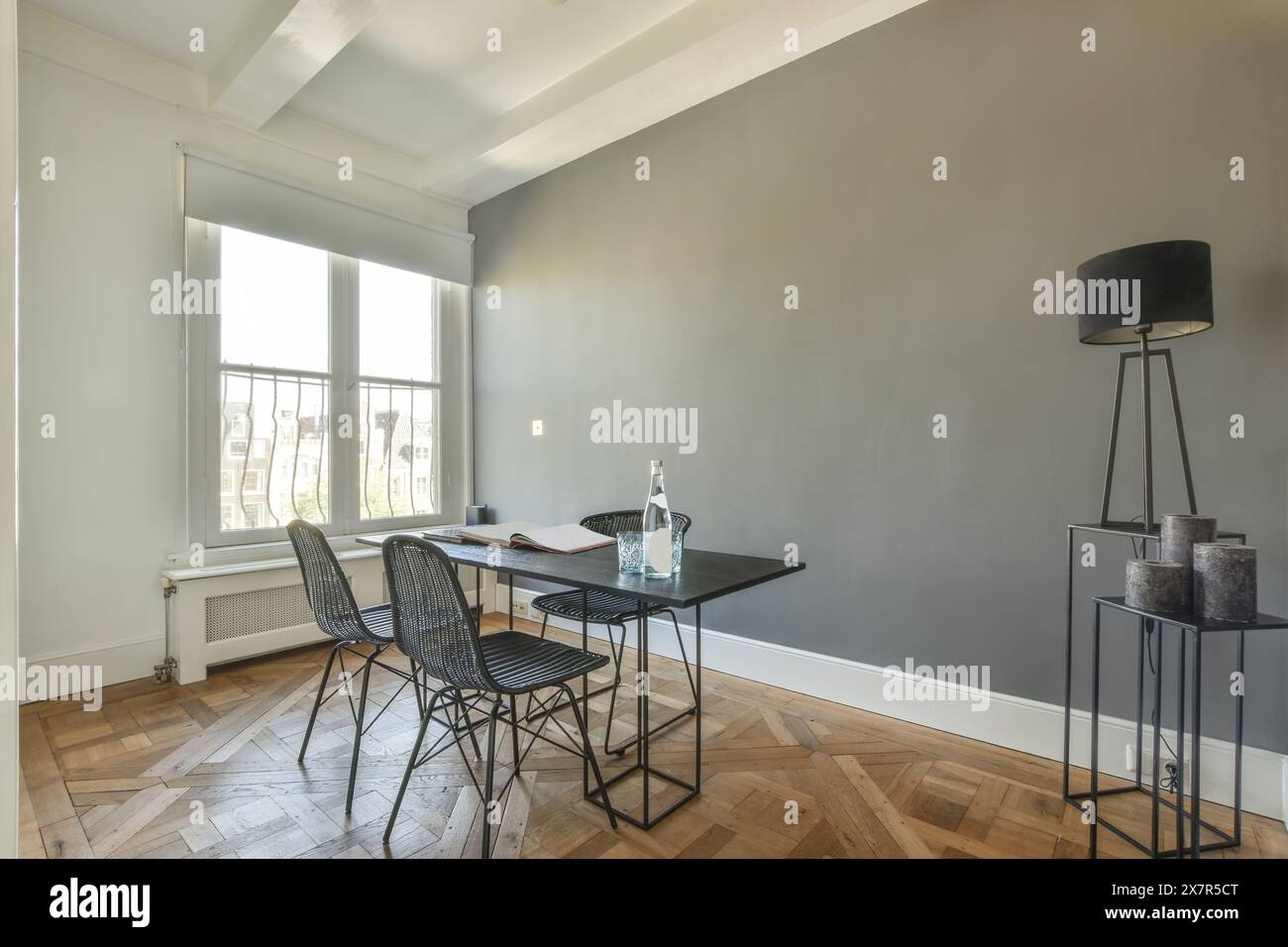 This serene dining room showcases a minimalist design featuring a tidy ...