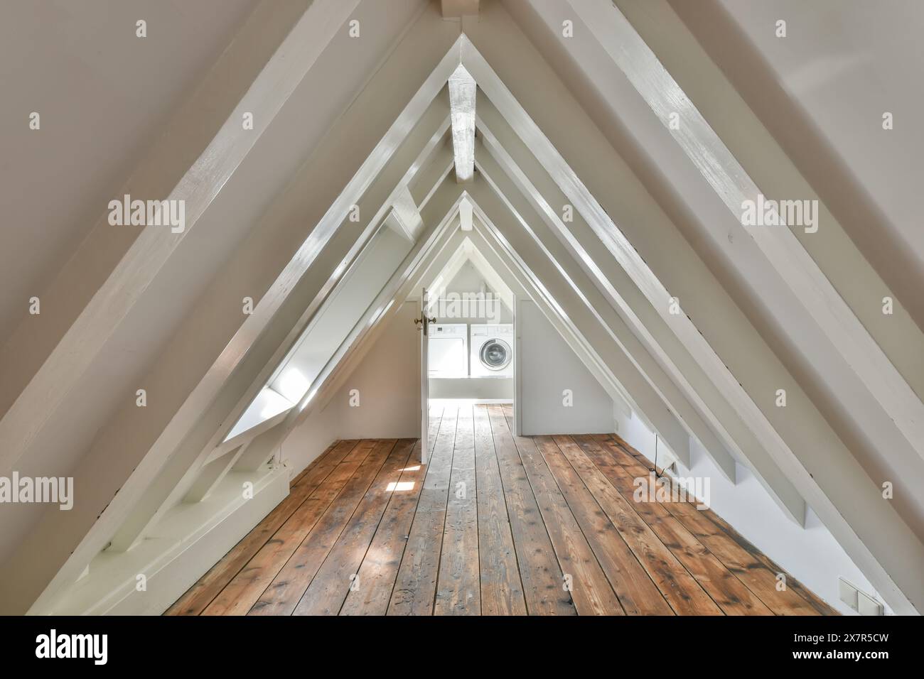 Interior view of a bright, cozy attic room featuring rustic wooden ...