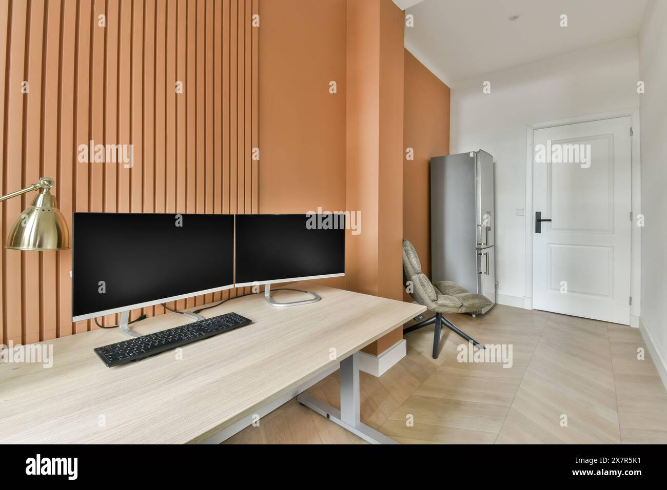 An elegantly designed home office featuring modern furniture with dual ...