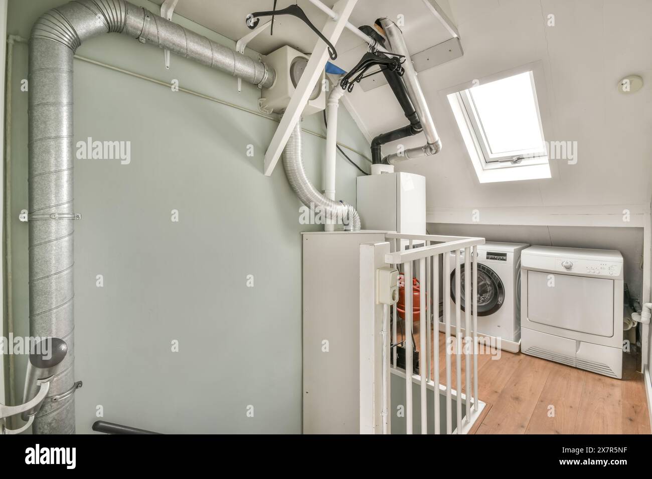 A neatly organized home laundry room featuring modern washer and dryer ...