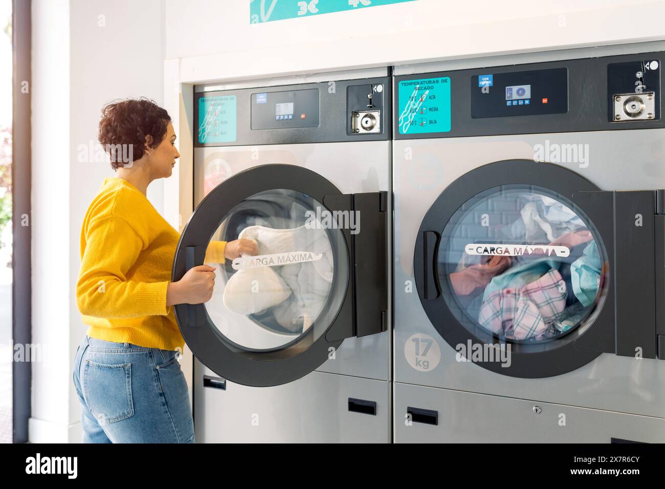 Attending to laundry hi-res stock photography and images - Alamy