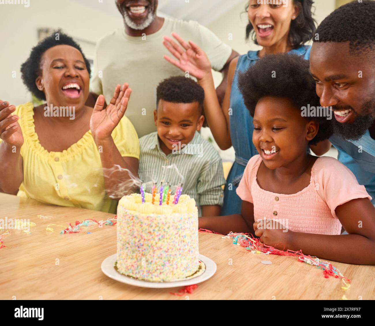 Multi-Generation Family Celebrating Granddaughter's Birthday At Home ...