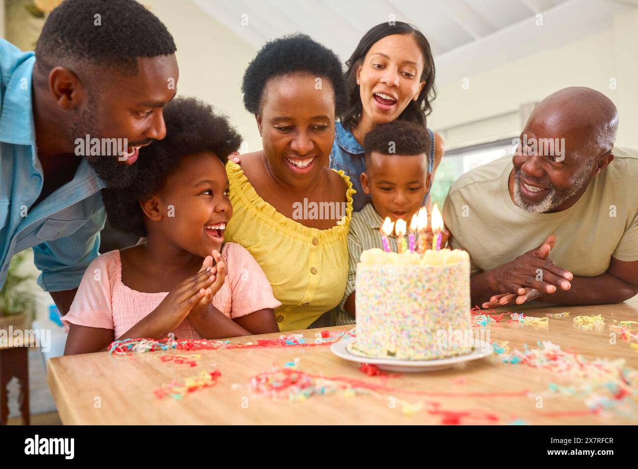 Multi-Generation Family Celebrating Grandson's Birthday At Home With ...