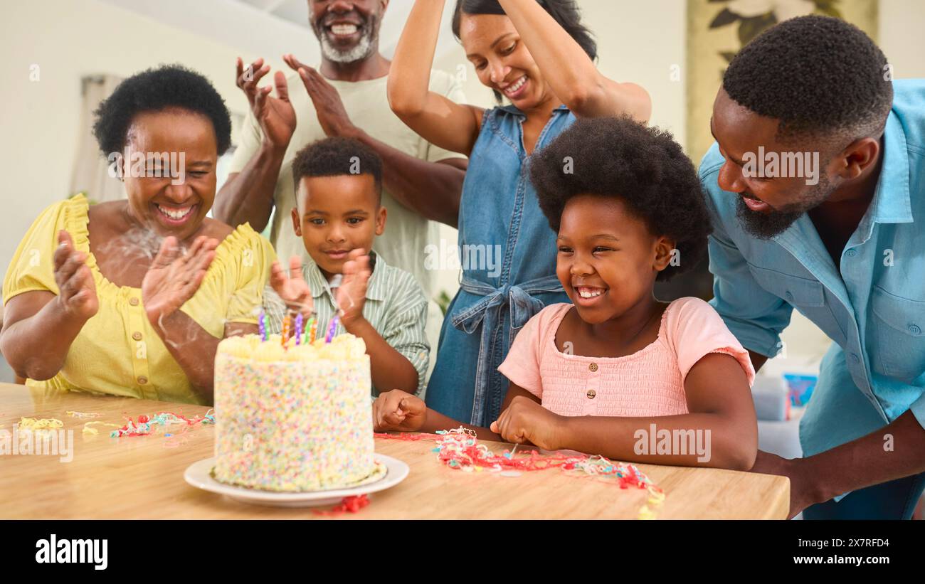 Multi-Generation Family Celebrating Granddaughter's Birthday At Home ...