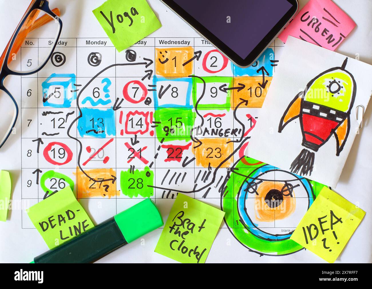 Calendar with business appointments, sticky notes and spectacles ...