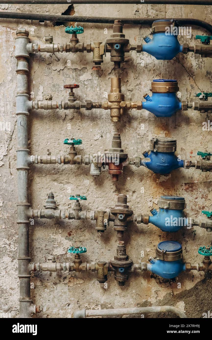 Water pipes with meters outside an old house in Italy Stock Photo - Alamy